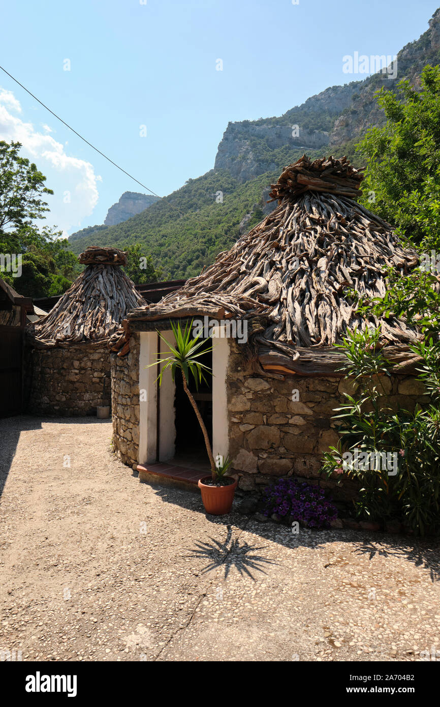 Traditional round stone and timbered roofed sheepfold shepherd huts in ...