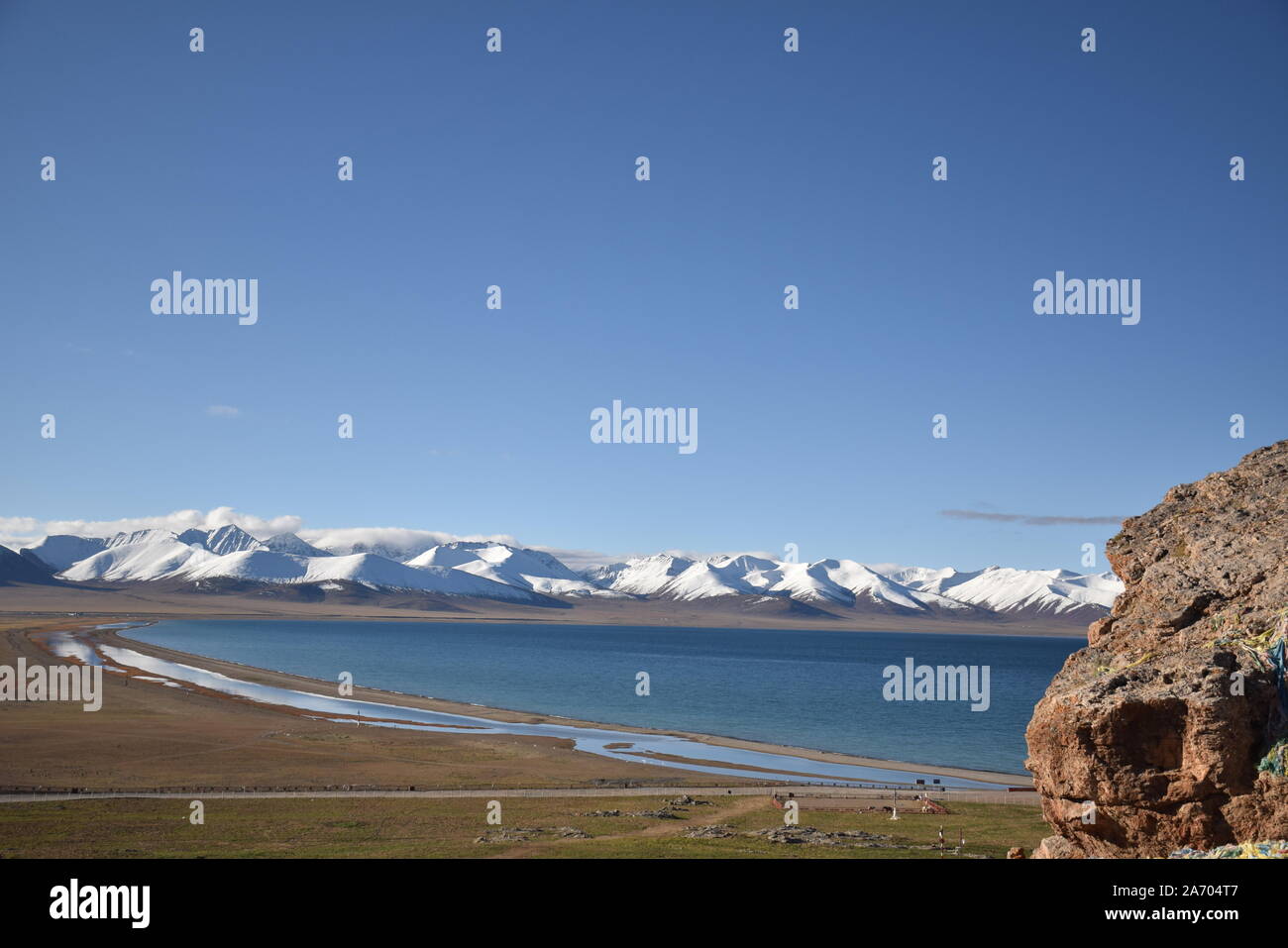 View of Namtso lake with snow capped mountains, Tibet. Namtso is the ...