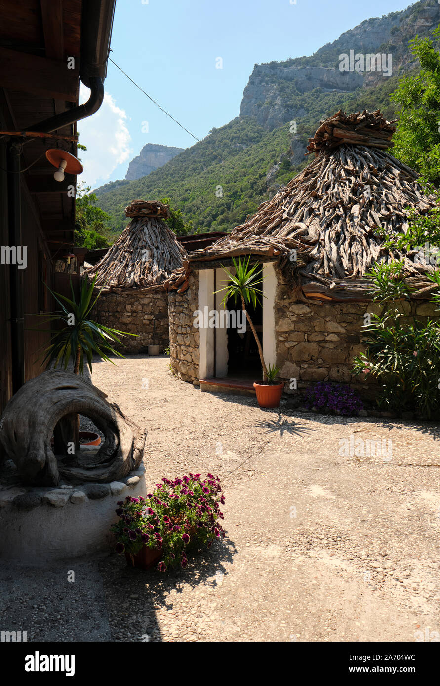 Traditional round stone and timbered roofed sheepfold shepherd huts in ...