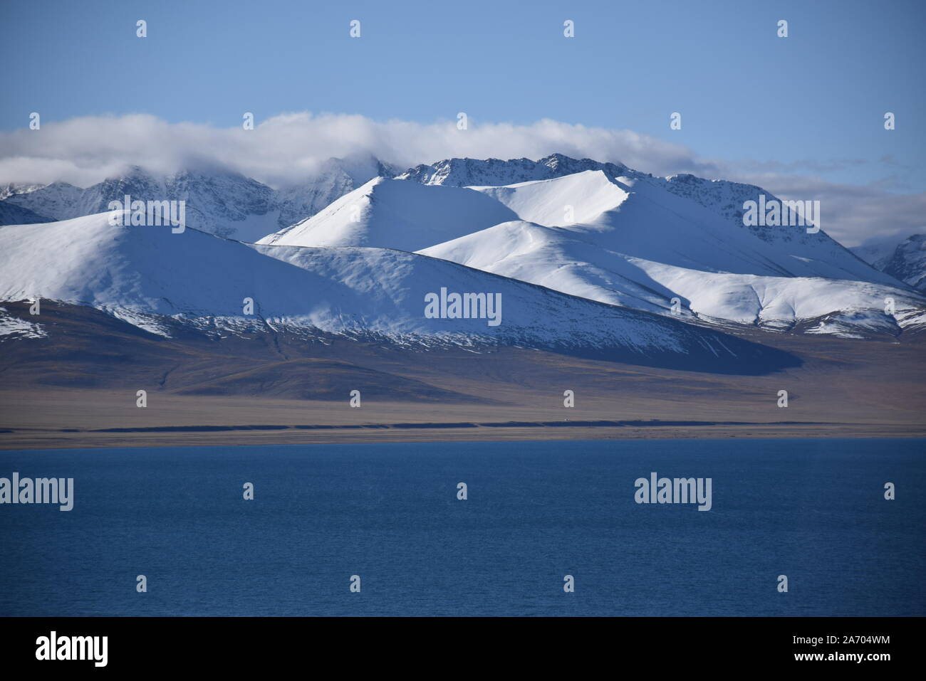 View of Namtso lake with snow capped mountains, Tibet. Namtso is the ...