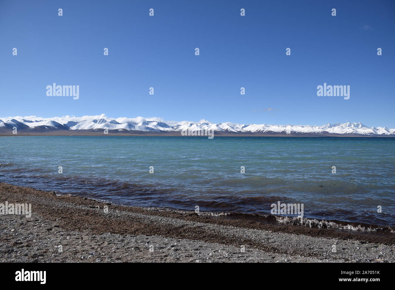 View of Namtso lake with snow capped mountains, Tibet. Namtso is the ...