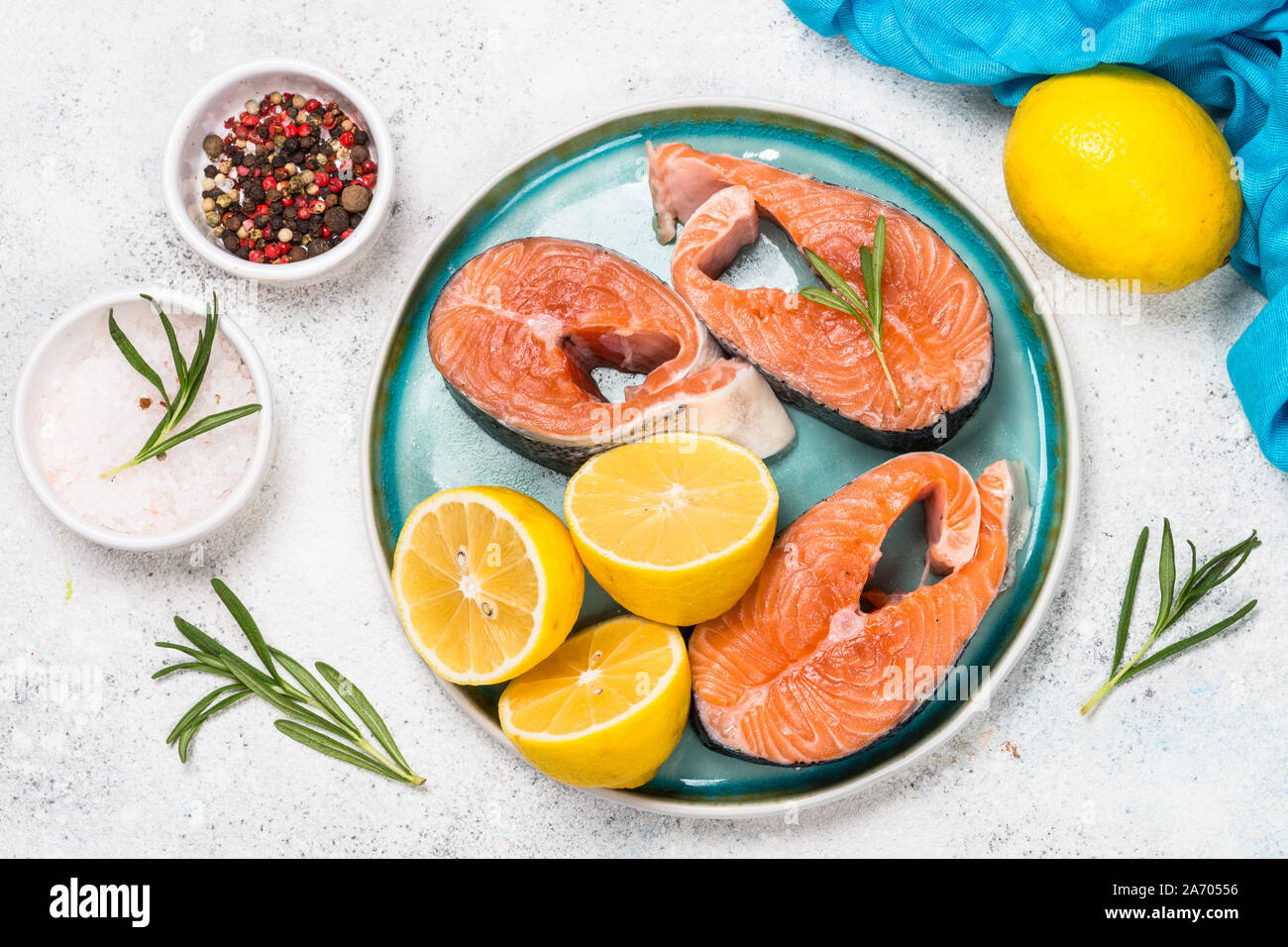 Raw salmon steak on white top view Stock Photo - Alamy