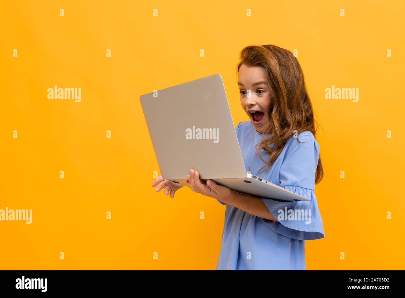 little girl joyfully screams at a laptop screen Stock Photo - Alamy