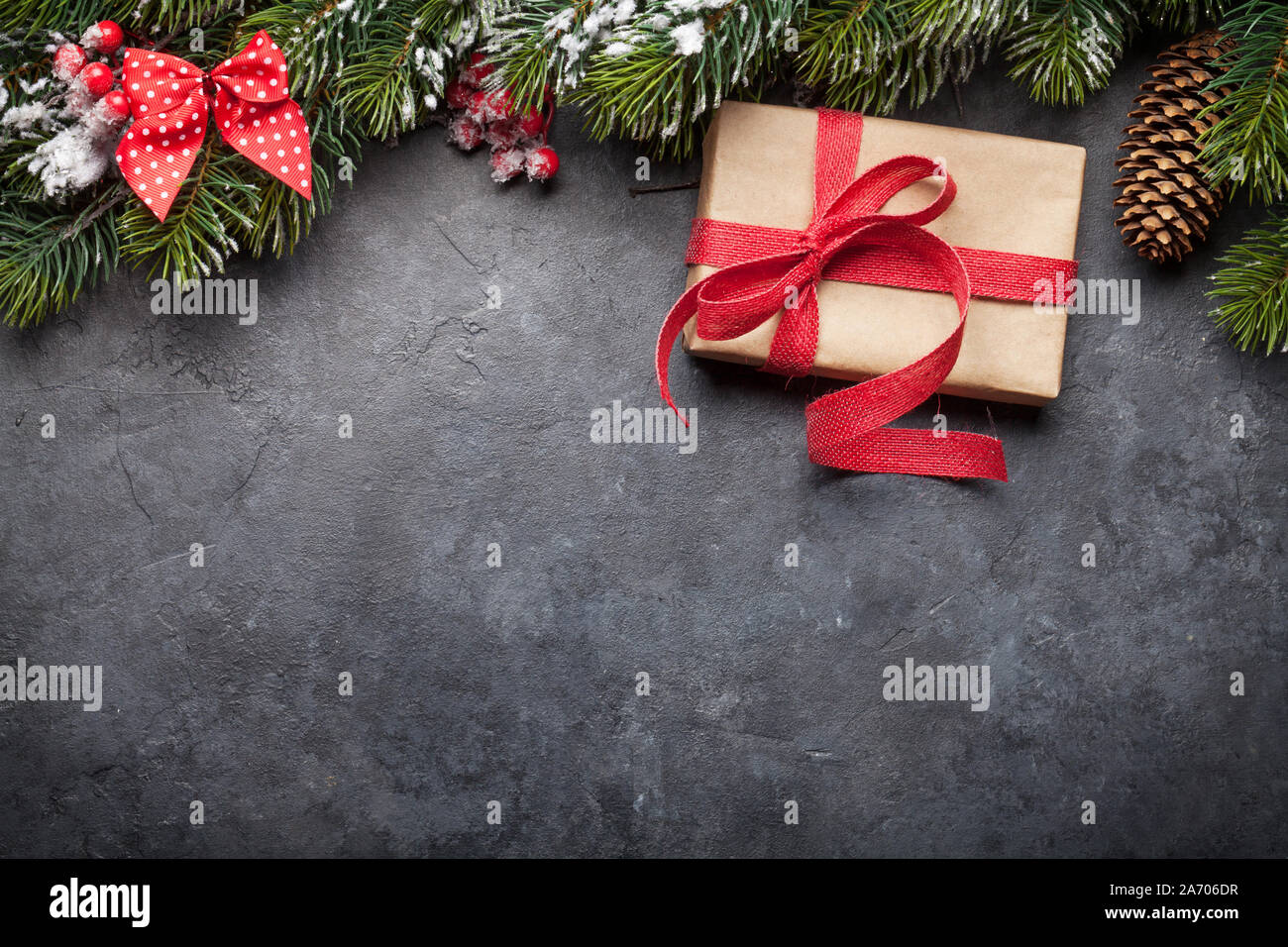 Christmas greeting card with decorated fir tree, gift box and copy ...