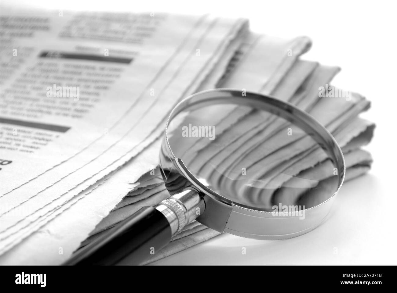 daily newspaper and a magnifying glass to find news Stock Photo - Alamy