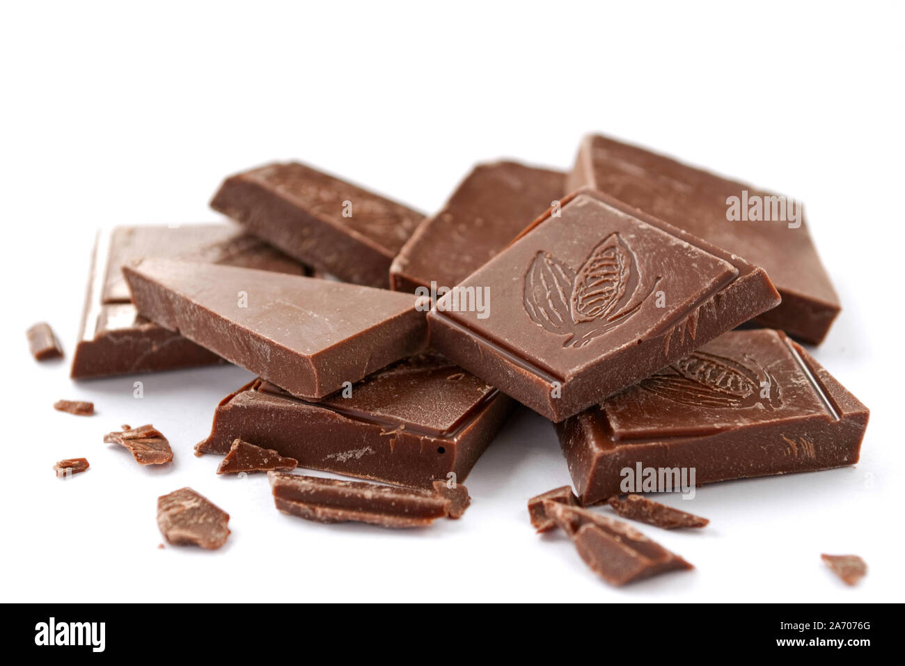 Broken chocolate bar on a white background Stock Photo - Alamy