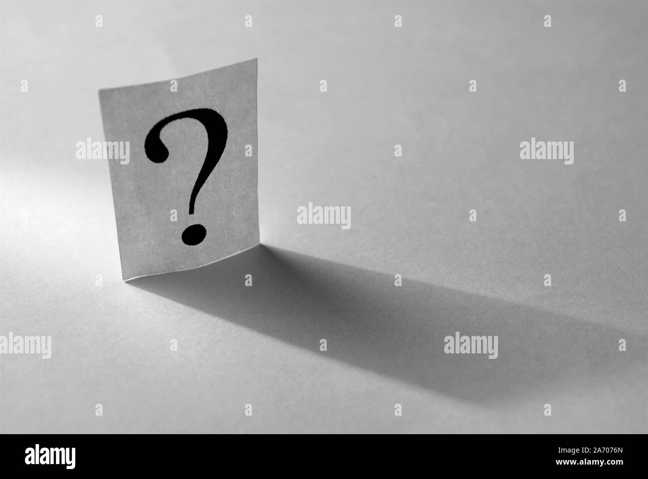 question mark on the paper and the light beam Stock Photo - Alamy