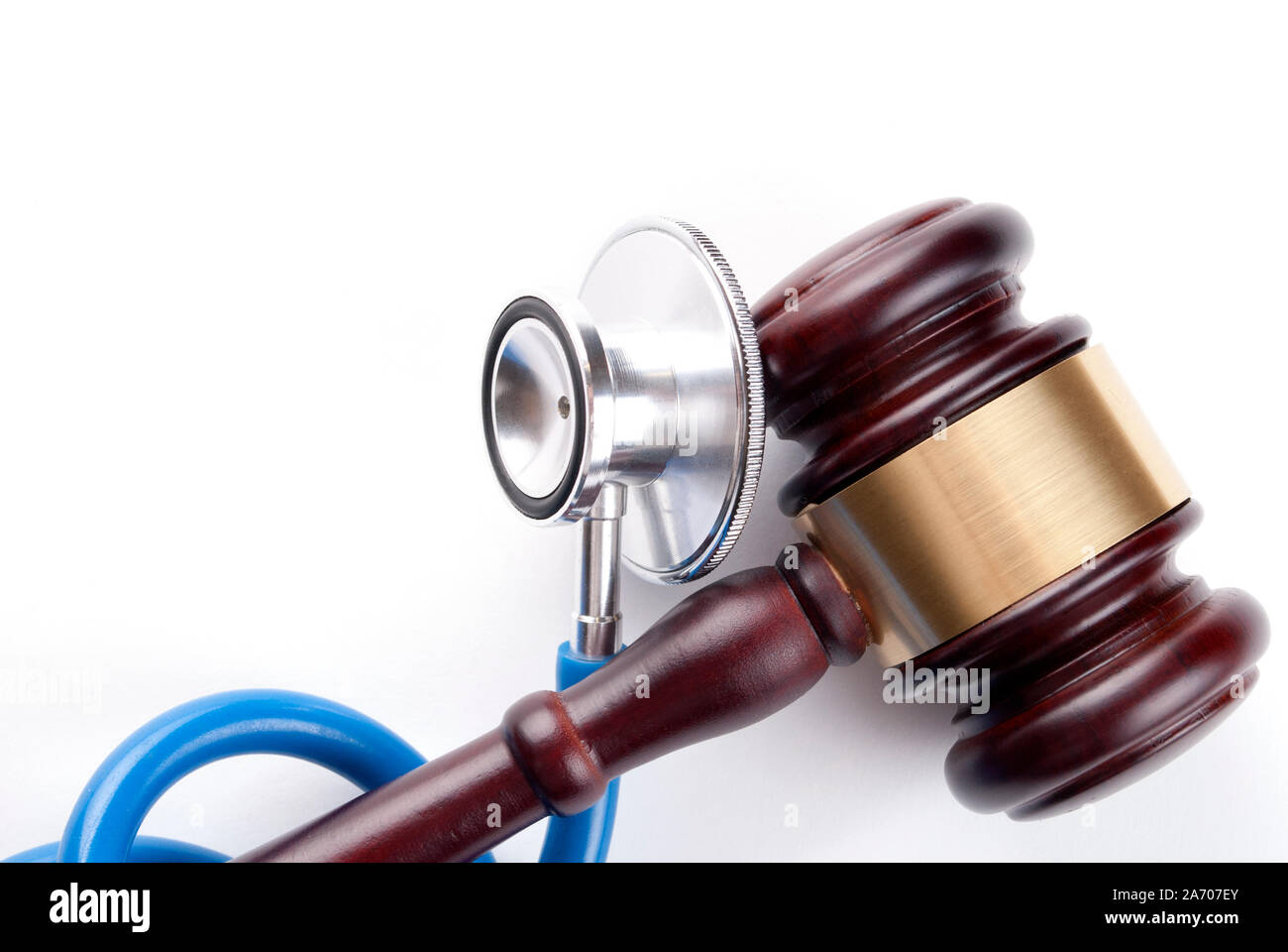 brown gavel and a medical stethoscope on white background Stock Photo ...