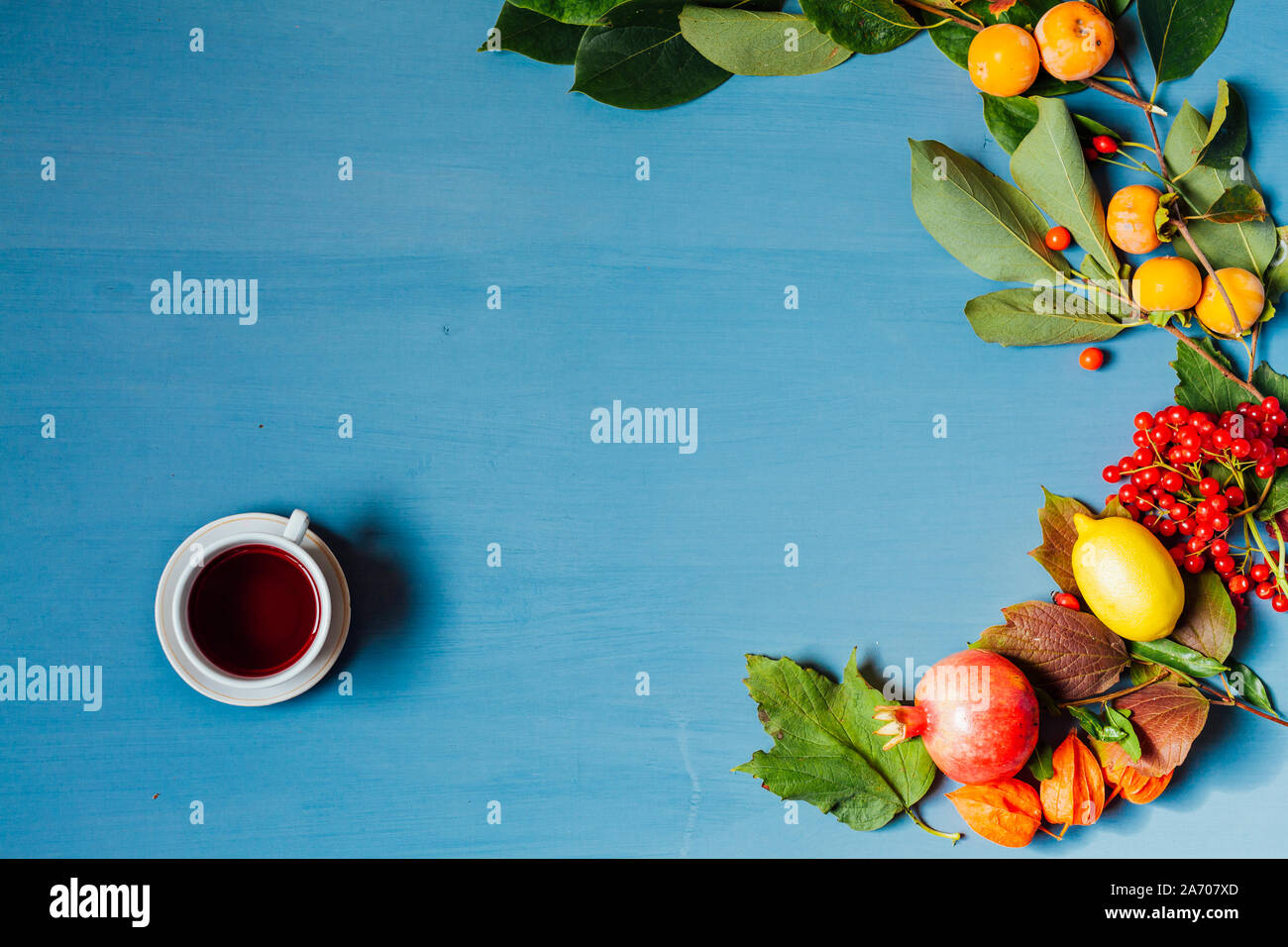 Red and yellow autumn leaves fruit nuts on a grey background Stock ...