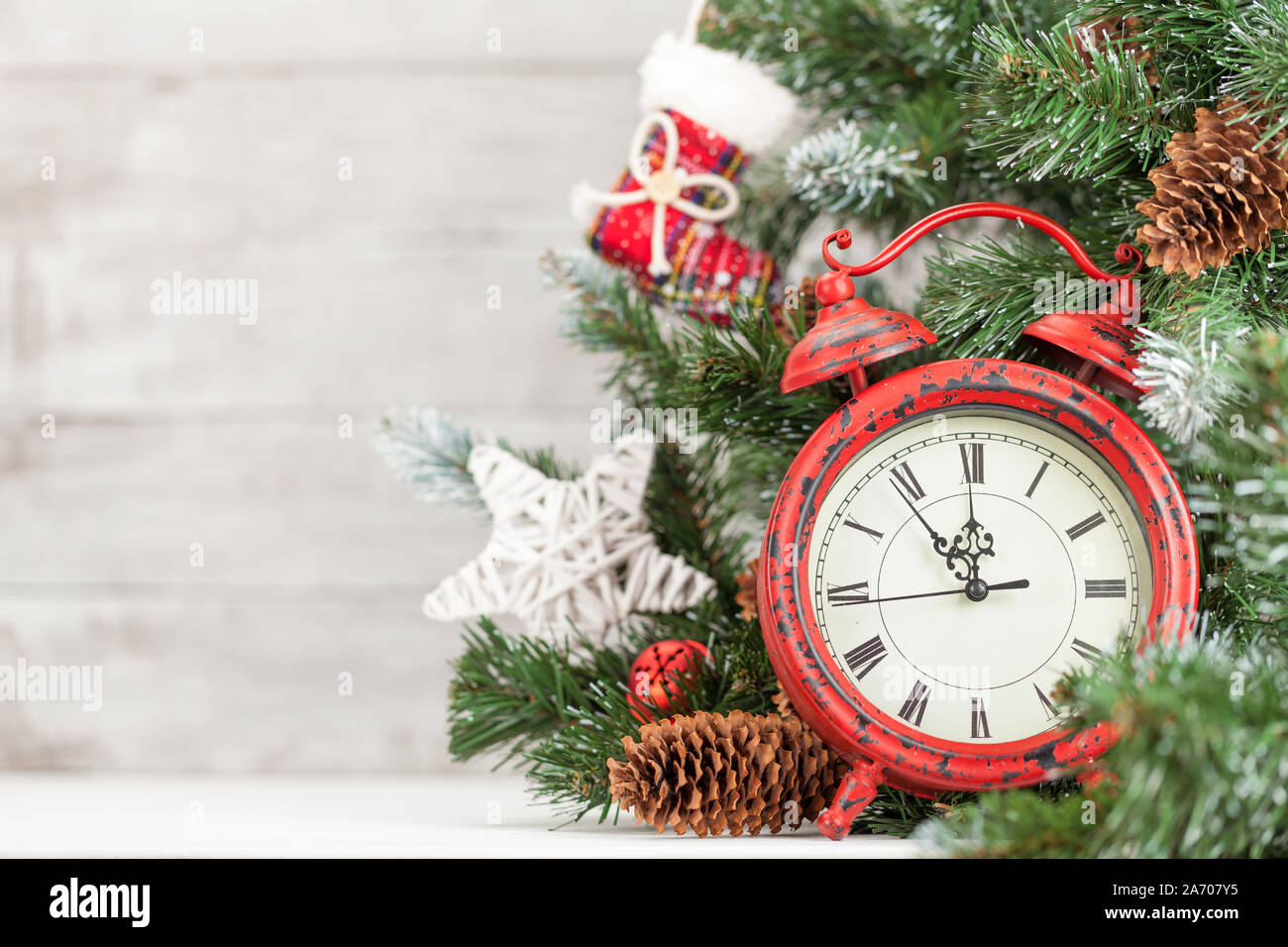 Christmas greeting card with decorated fir tree, alarm clock and copy ...