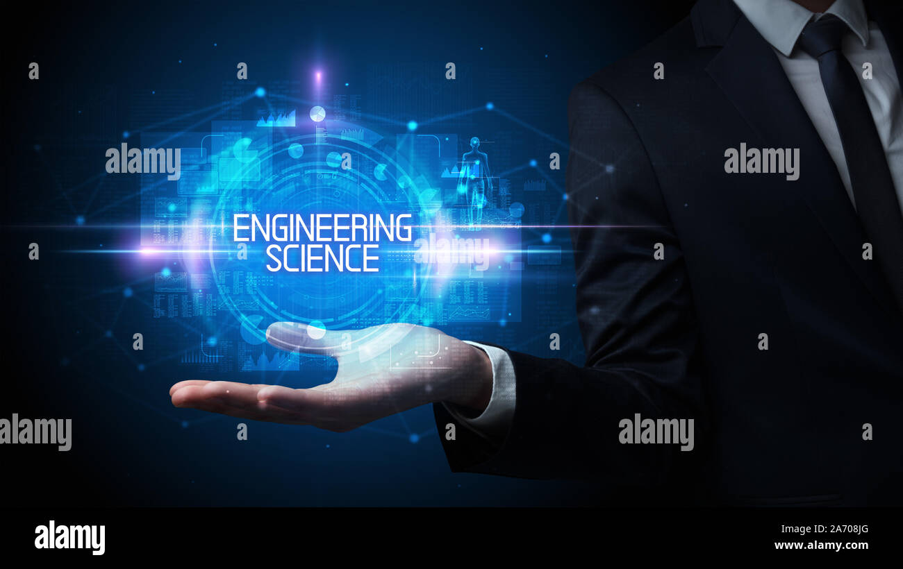 Man hand holding ENGINEERING SCIENCE inscription, technology concept ...