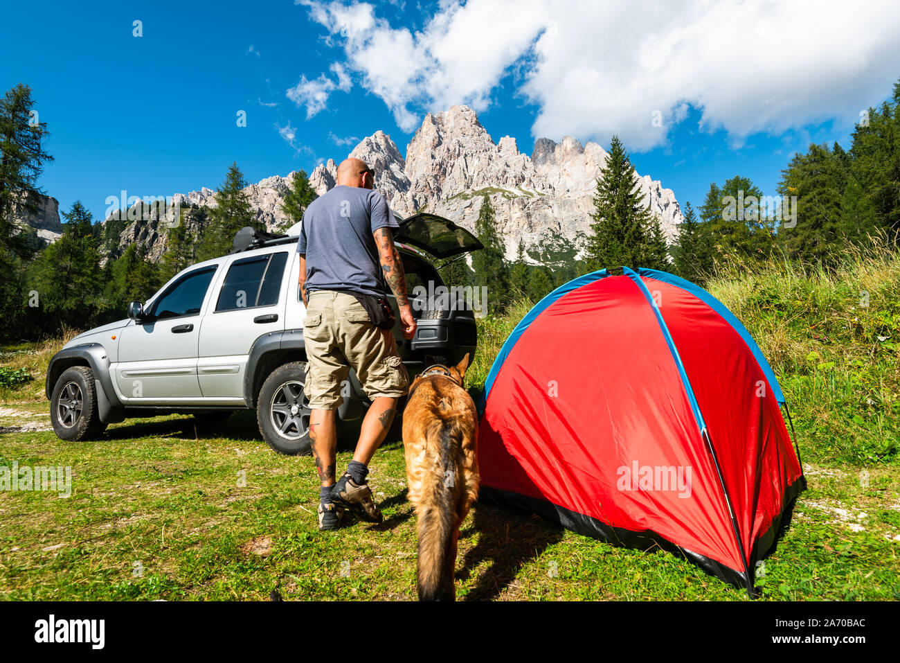 Man with Dog at Outdoor Adventure. Tent and Off Road Car. Leisure ...