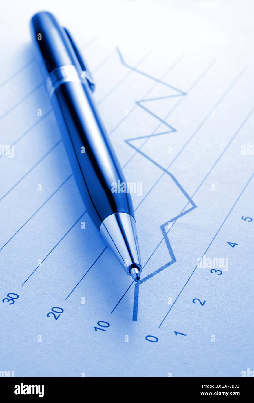 ballpoint pen and a piece of graph Stock Photo - Alamy