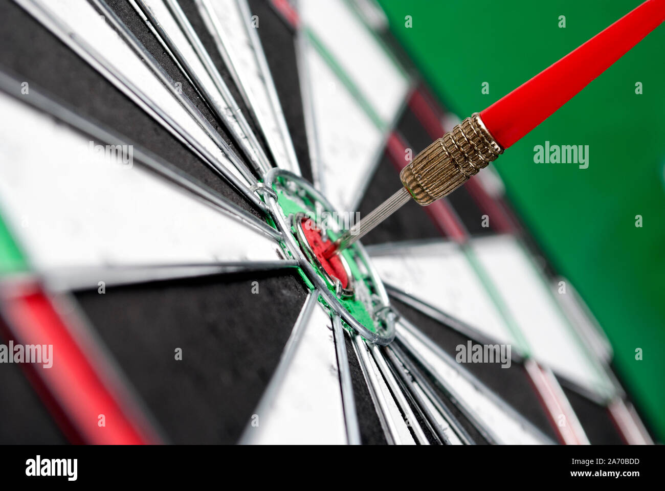 darts arrows in the target center Stock Photo - Alamy