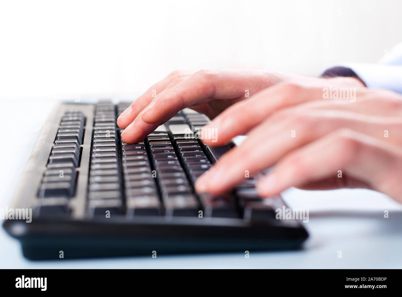 man's hand on computer keyboard woman's hand on the keyboard typing ...