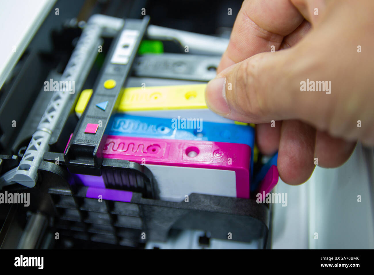 Technicians are install setup the ink cartridge of a inkjet printer the ...