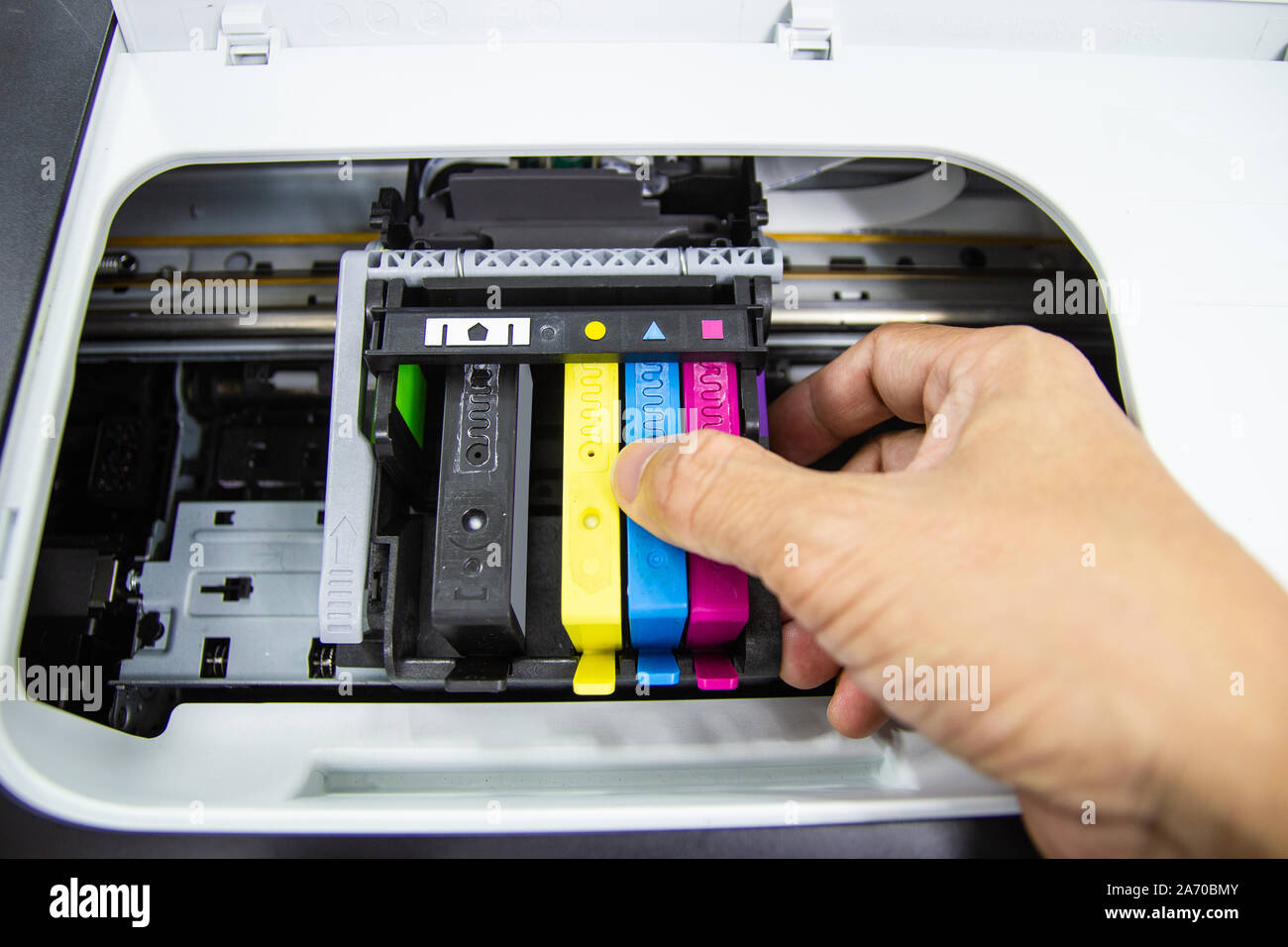 Technicians are install setup the ink cartridge of a inkjet printer the ...