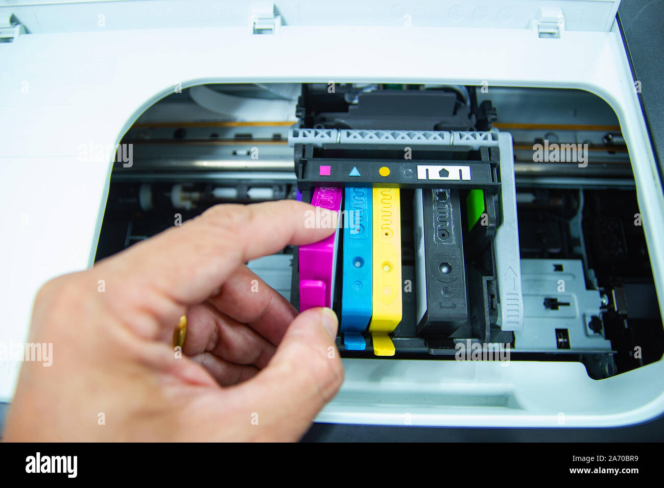 Technicians are install setup the ink cartridge of a inkjet printer the ...