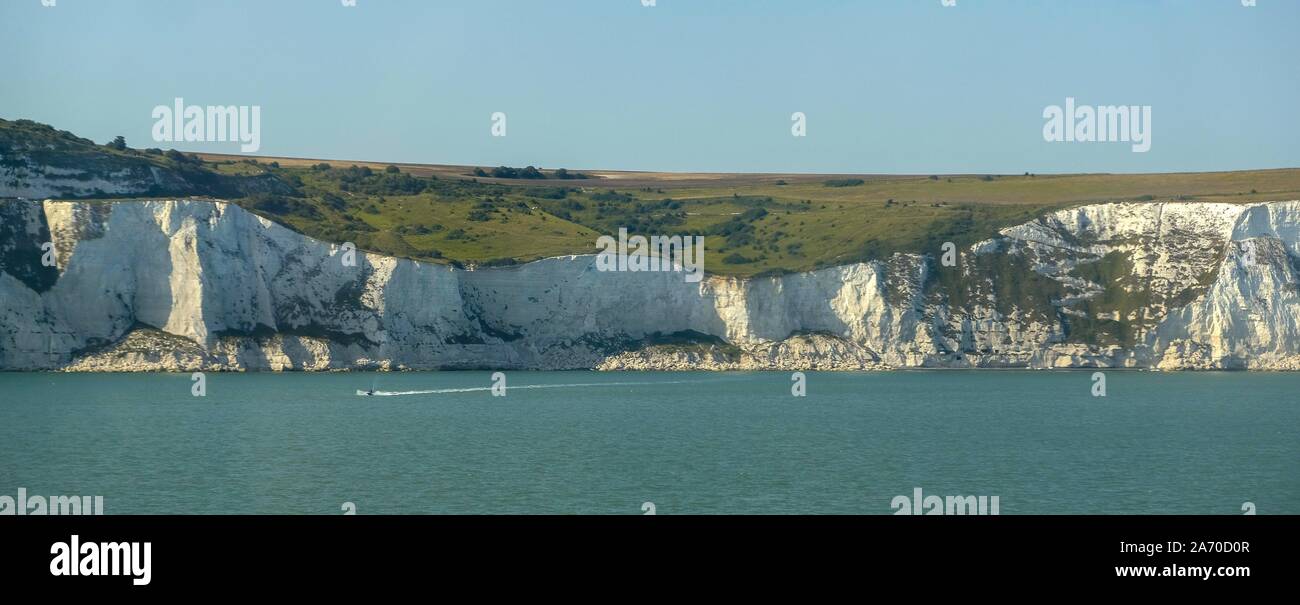 View at white cliffs of Dover, grass, trees and rocks Stock Photo - Alamy