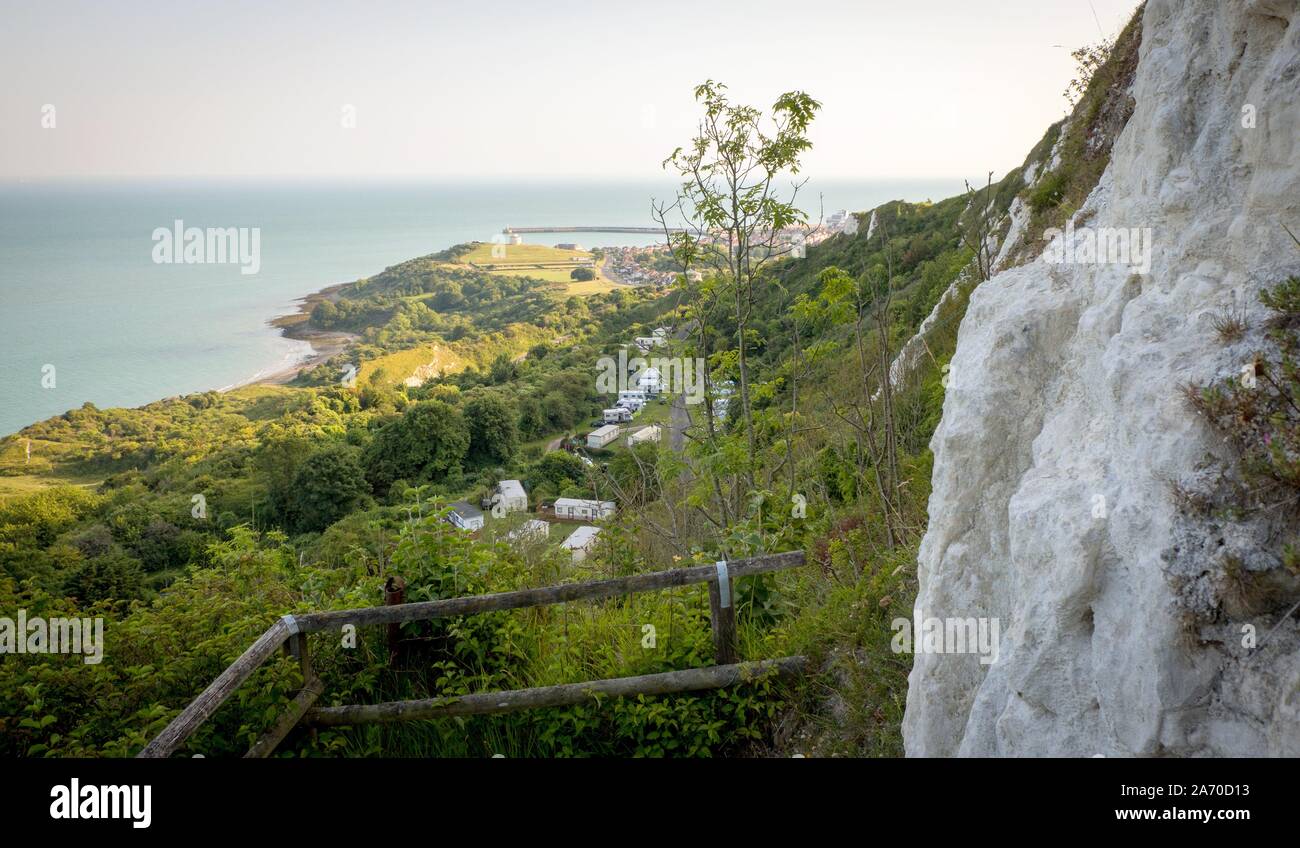 View at white cliffs of Dover, grass, trees and rocks Stock Photo - Alamy