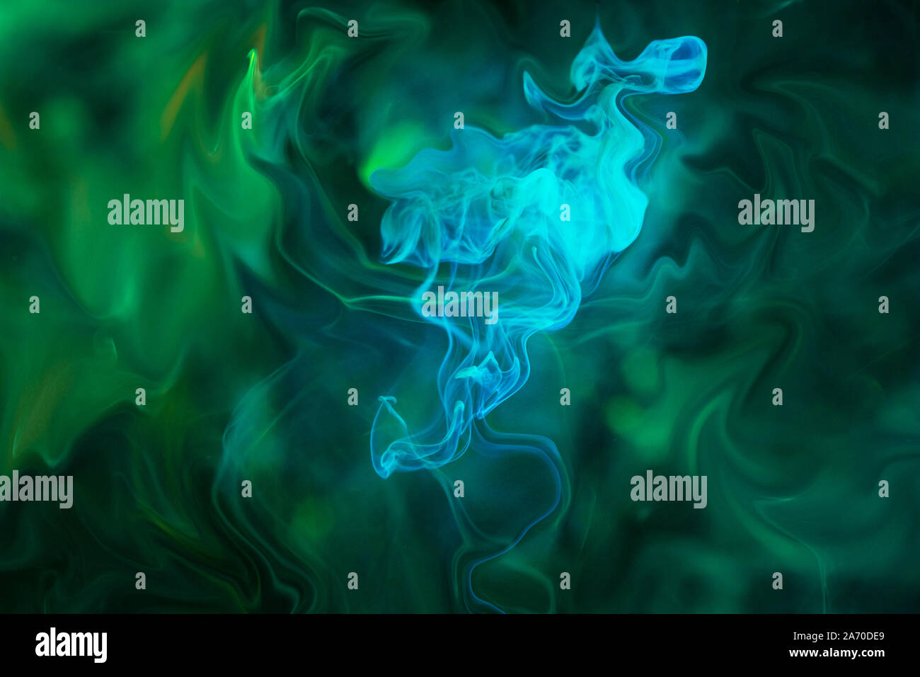 Blue diffusion of ink in liquid Stock Photo - Alamy