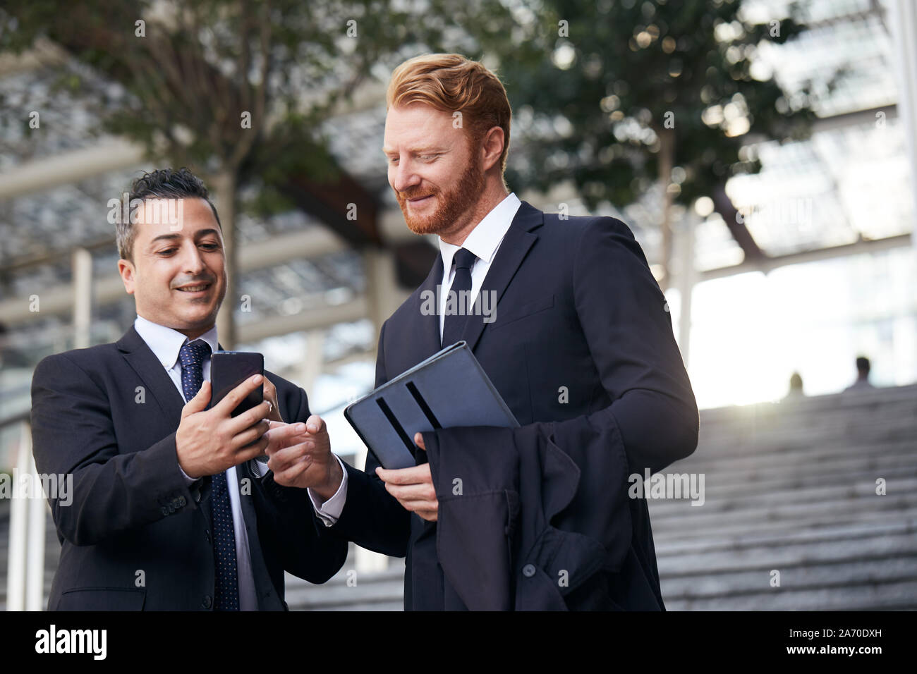 business people working outside office building Stock Photo - Alamy
