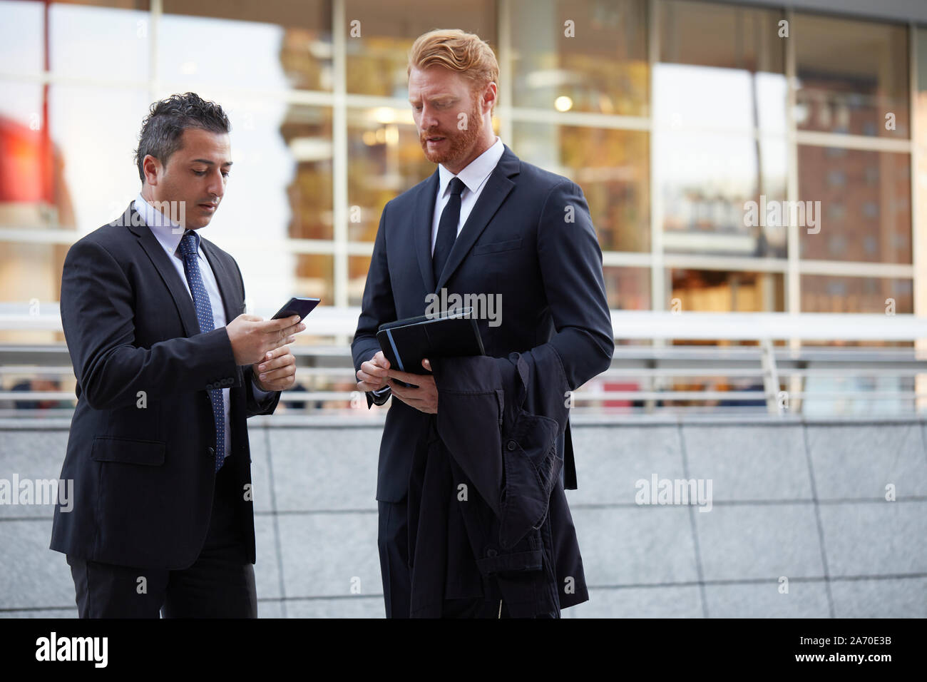 business people working outside office building Stock Photo - Alamy