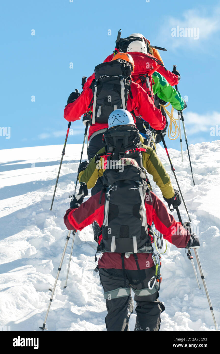Rope team ascending to mountain top in high alpine region of Monte Rosa ...