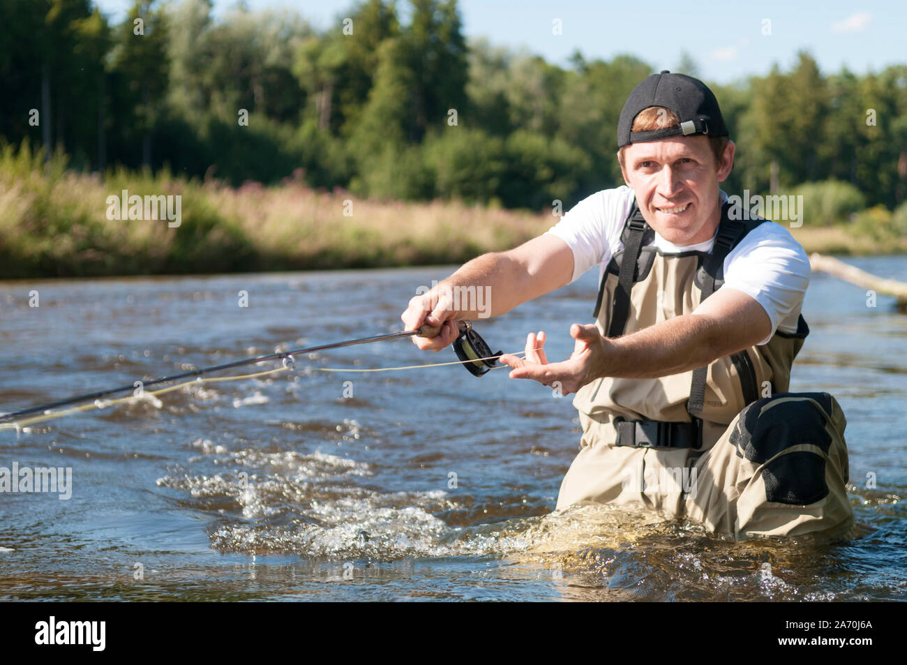 Flyfisher in action Stock Photo - Alamy