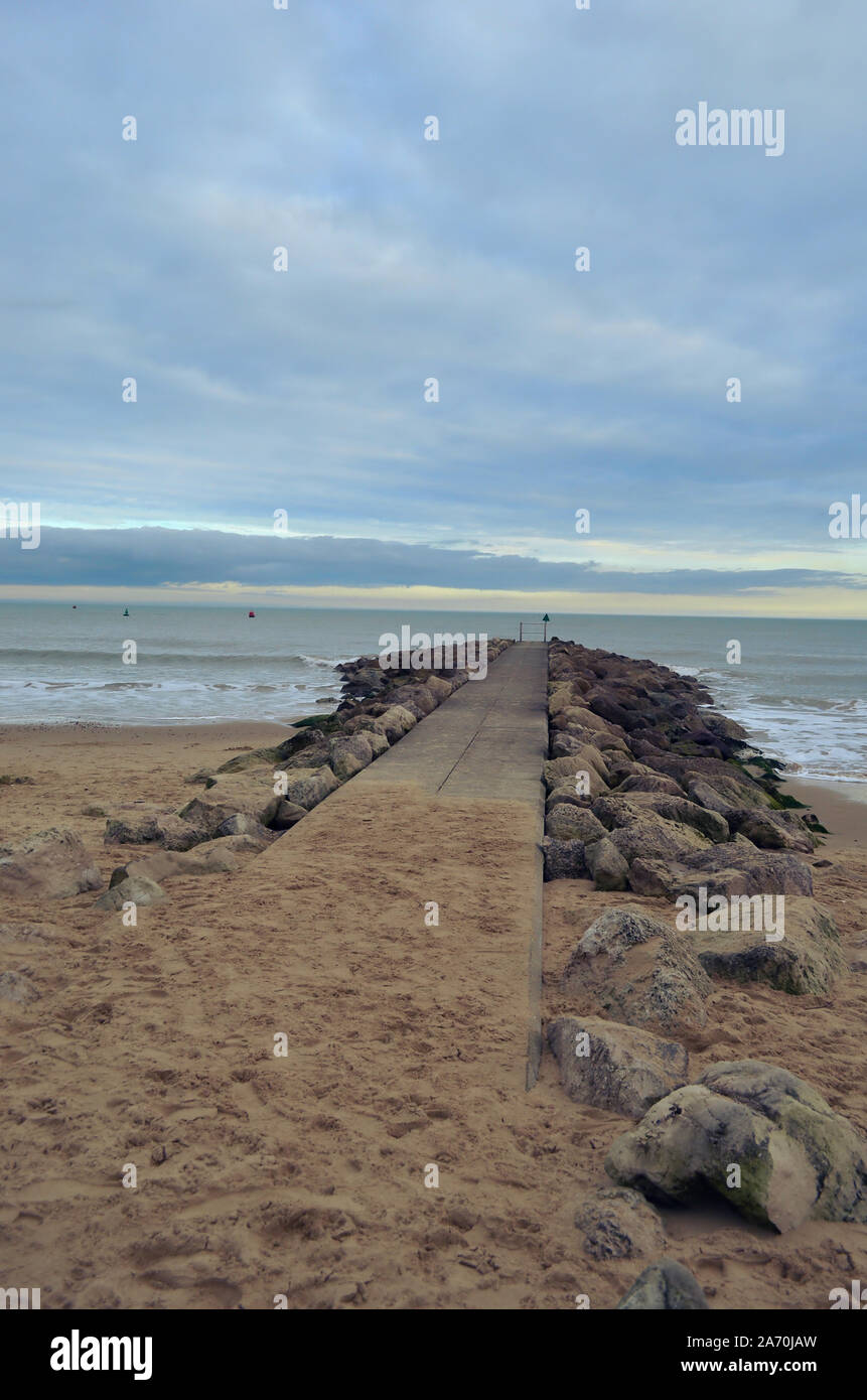 Rock Pier on the Beach Stock Photo - Alamy