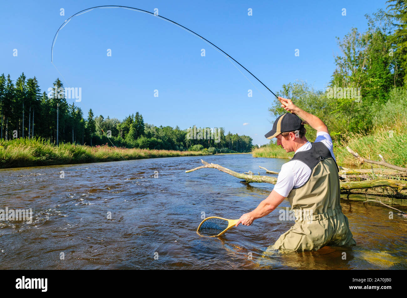 Flyfisher in action Stock Photo - Alamy