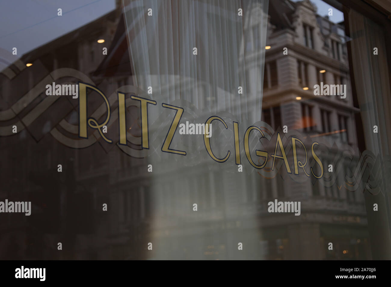 Ritz Cigars gold lettering on window of The Ritz Hotel Cigar bar on ...