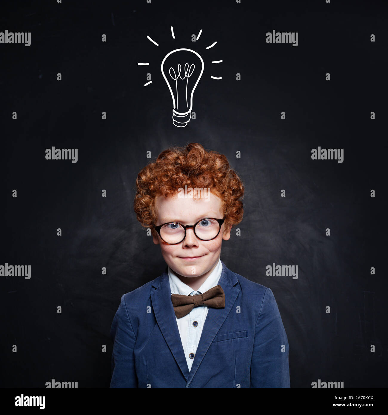 Smart kid with lightbulb portrait Stock Photo - Alamy