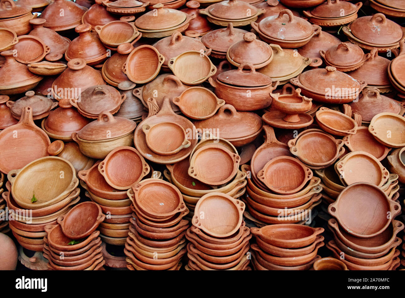 Large number of pottery sold in the streets of Morocco. Clay plates ...