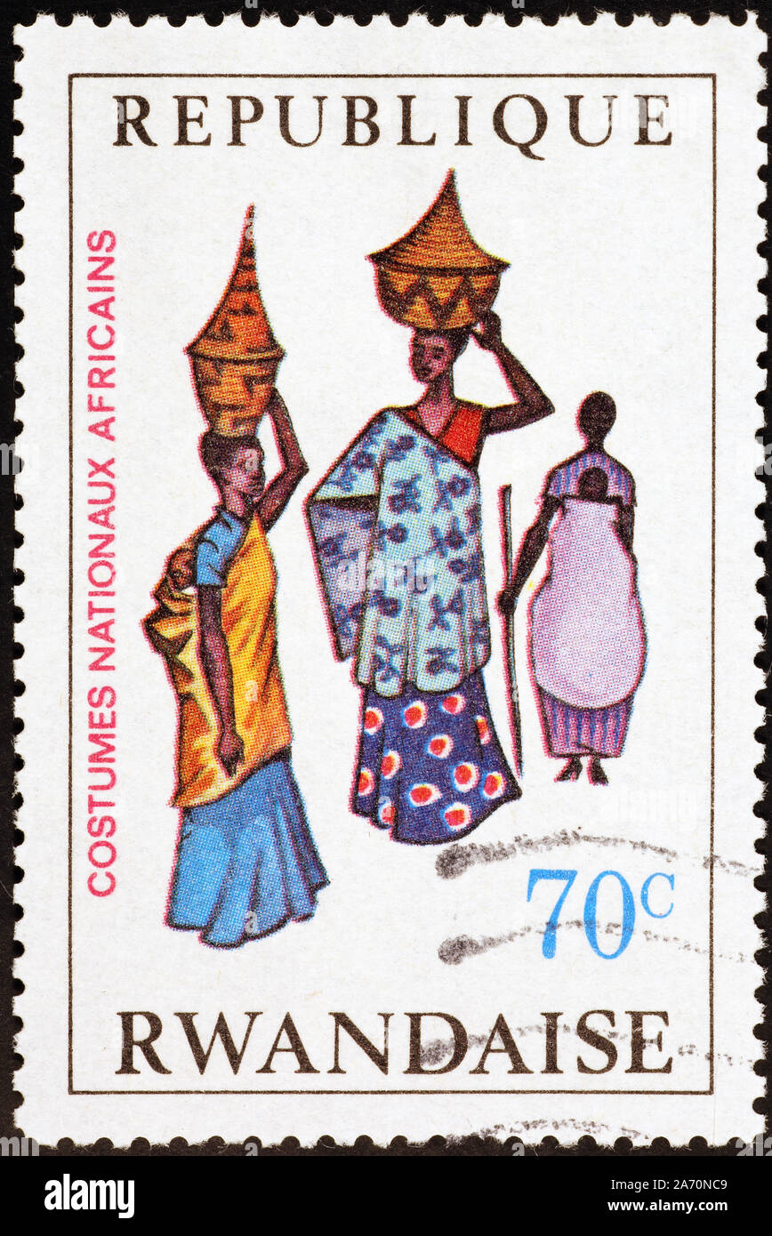 Traditional african dresses on postage stamp of Rwanda Stock Photo - Alamy