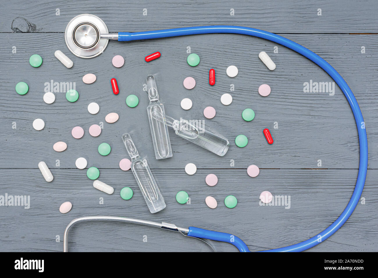 Stethoscope and various medical drugs on the table Stock Photo - Alamy