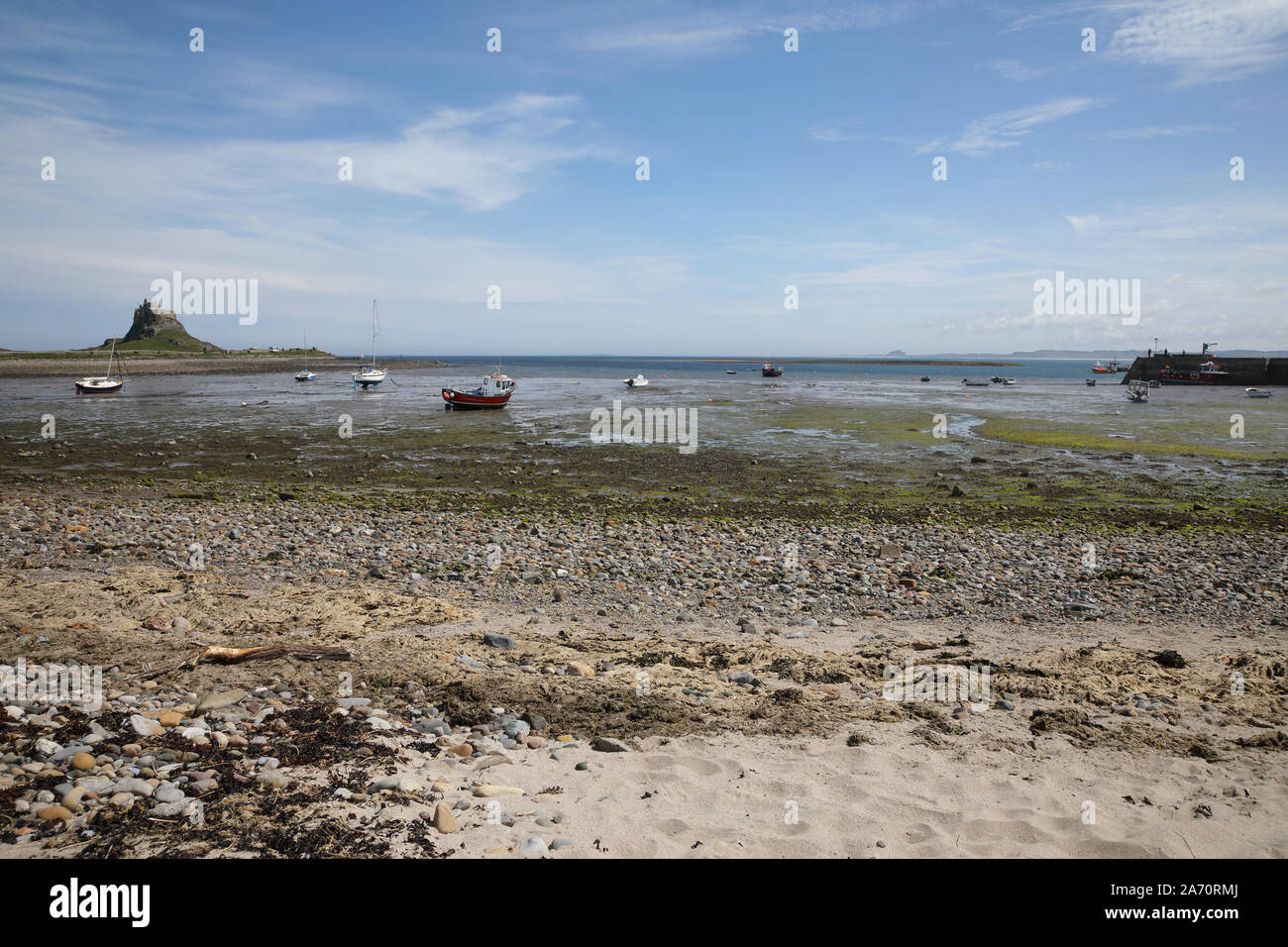 Fishing boats holy island beach hi-res stock photography and images - Alamy