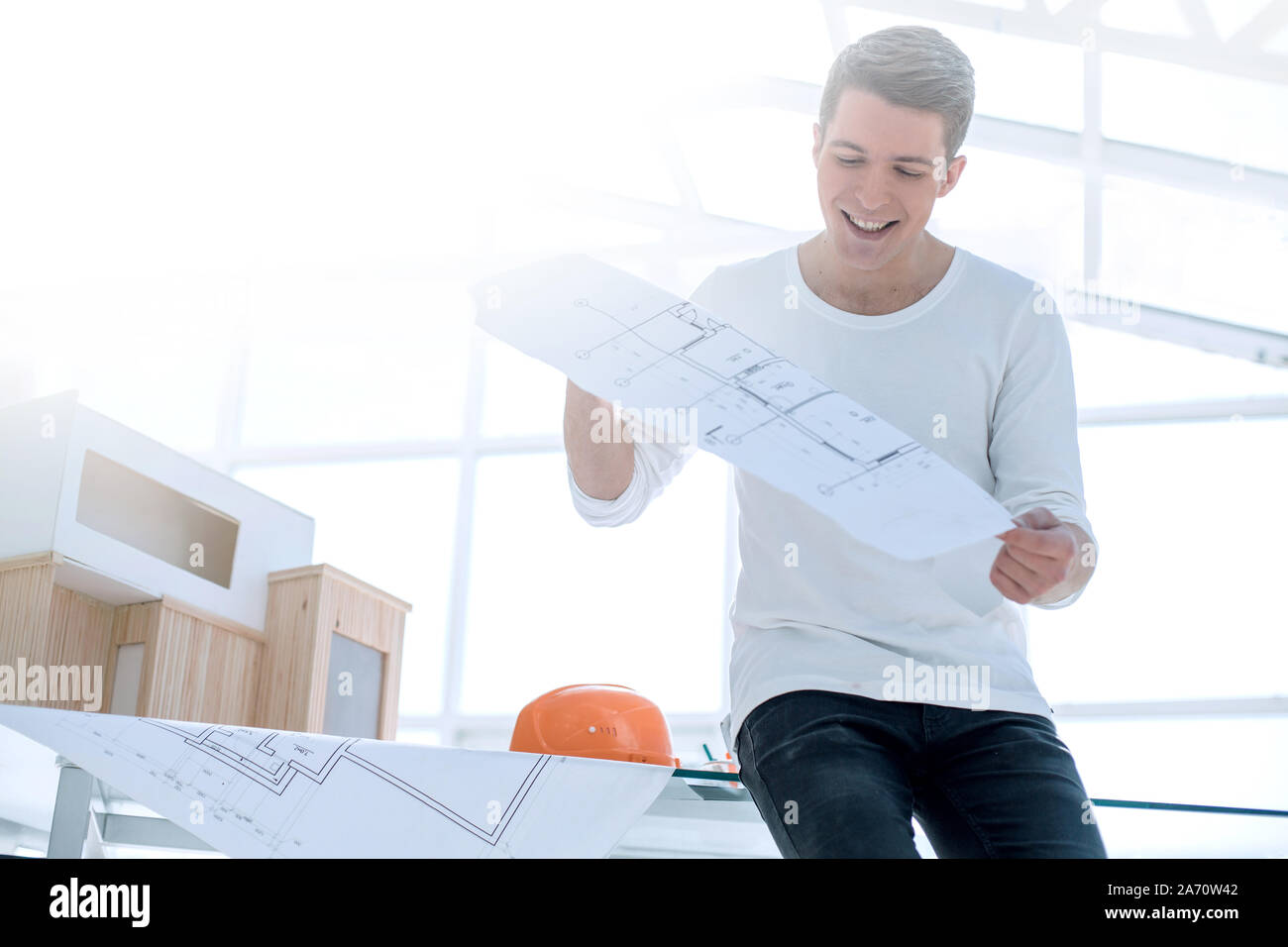 male designer looking at a sketch of a new project Stock Photo - Alamy