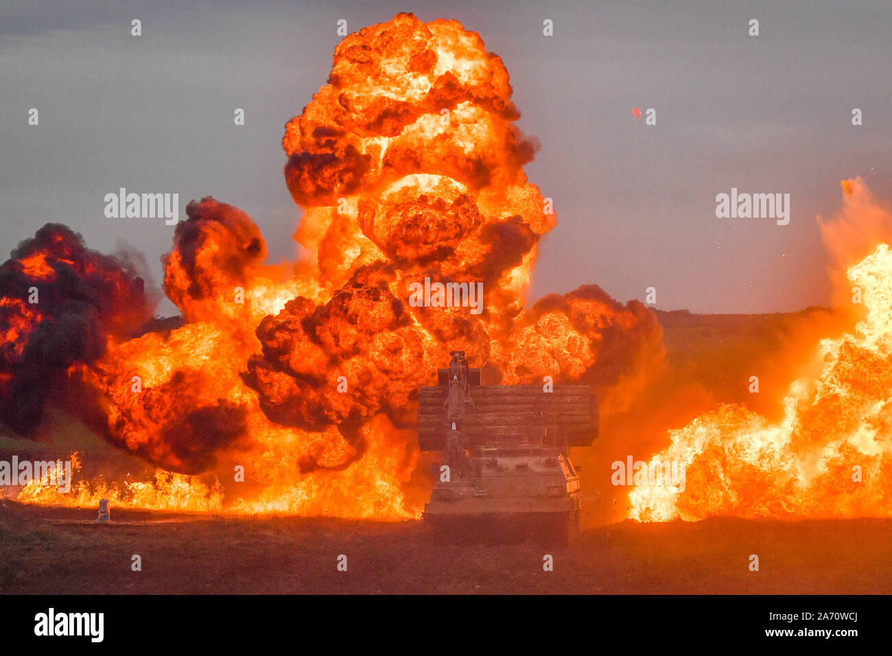 A Warrior Armoured Vehicle powers through an explosion during the Army ...