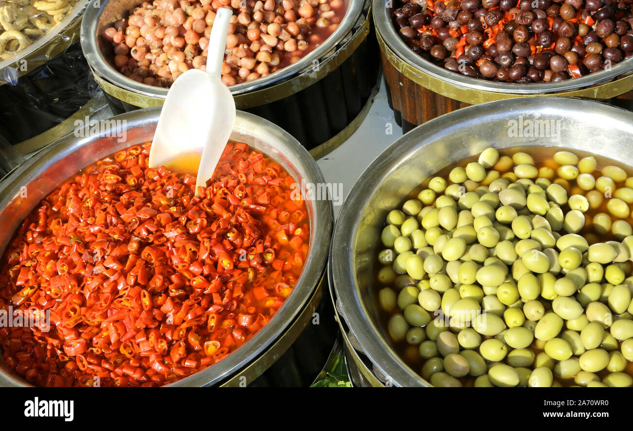 Mediterranean market stall with olives and red peppers for sale Stock ...