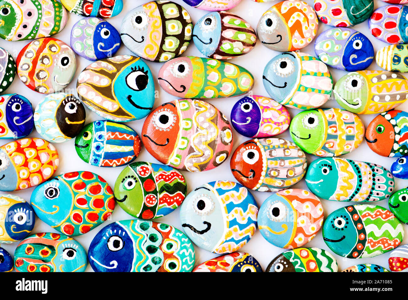 Funny painted acrylic pebbles background Stock Photo - Alamy