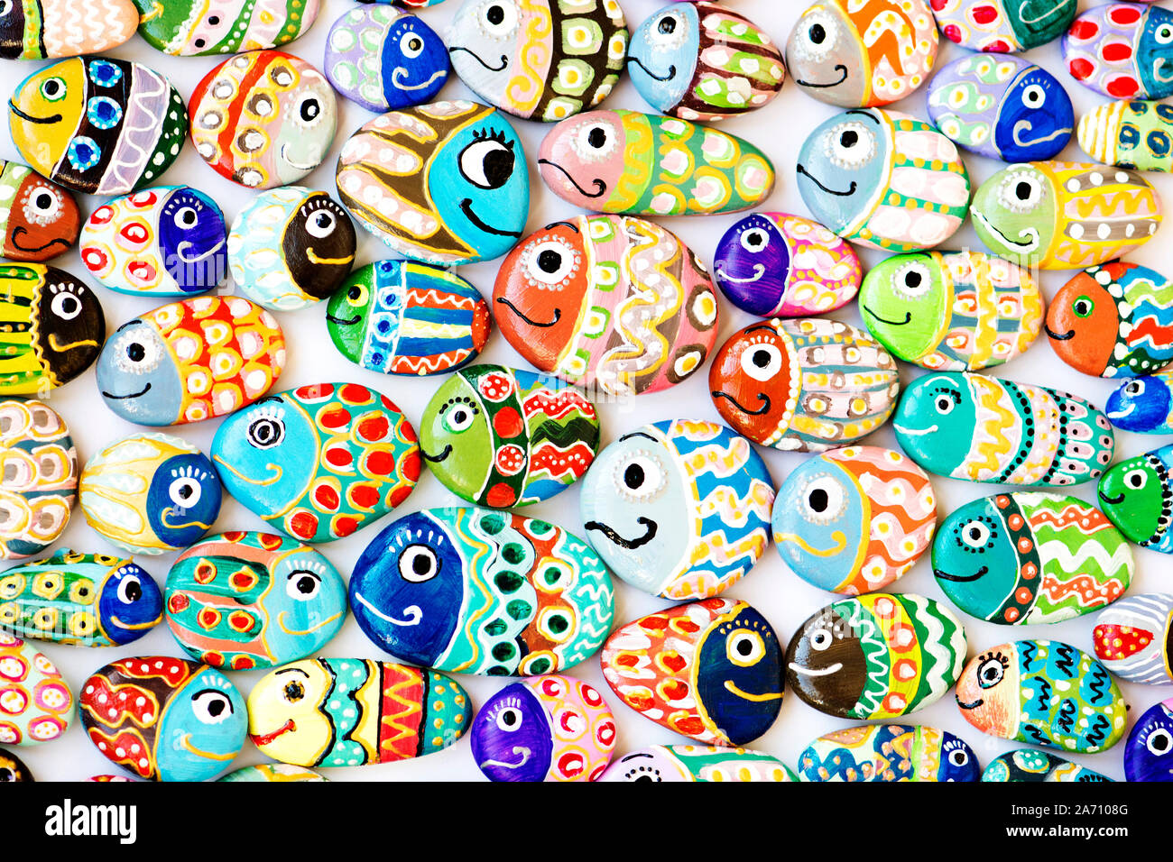 Funny painted acrylic pebbles background Stock Photo - Alamy