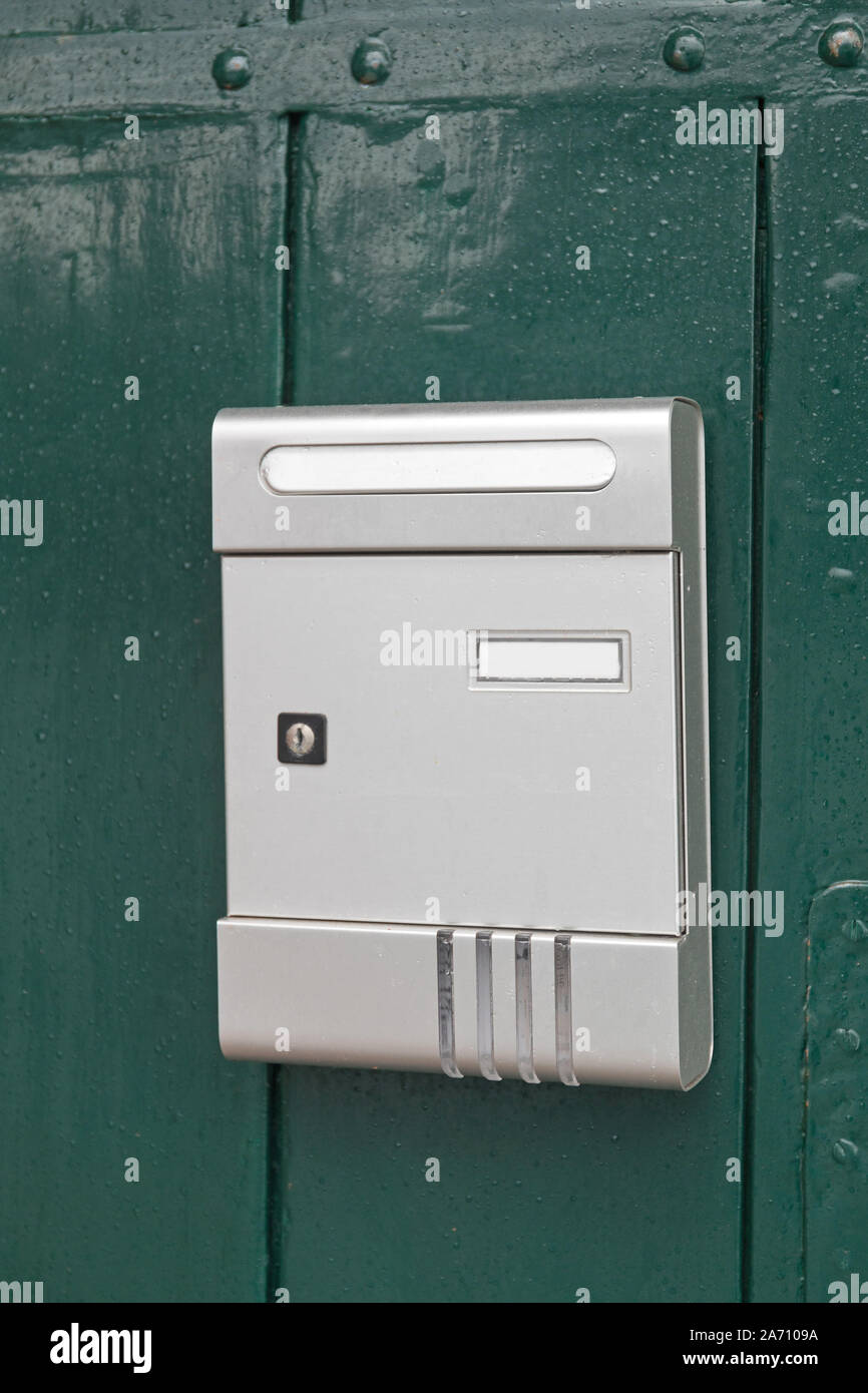 Modern Silver Metal Letter Box at Door Stock Photo - Alamy