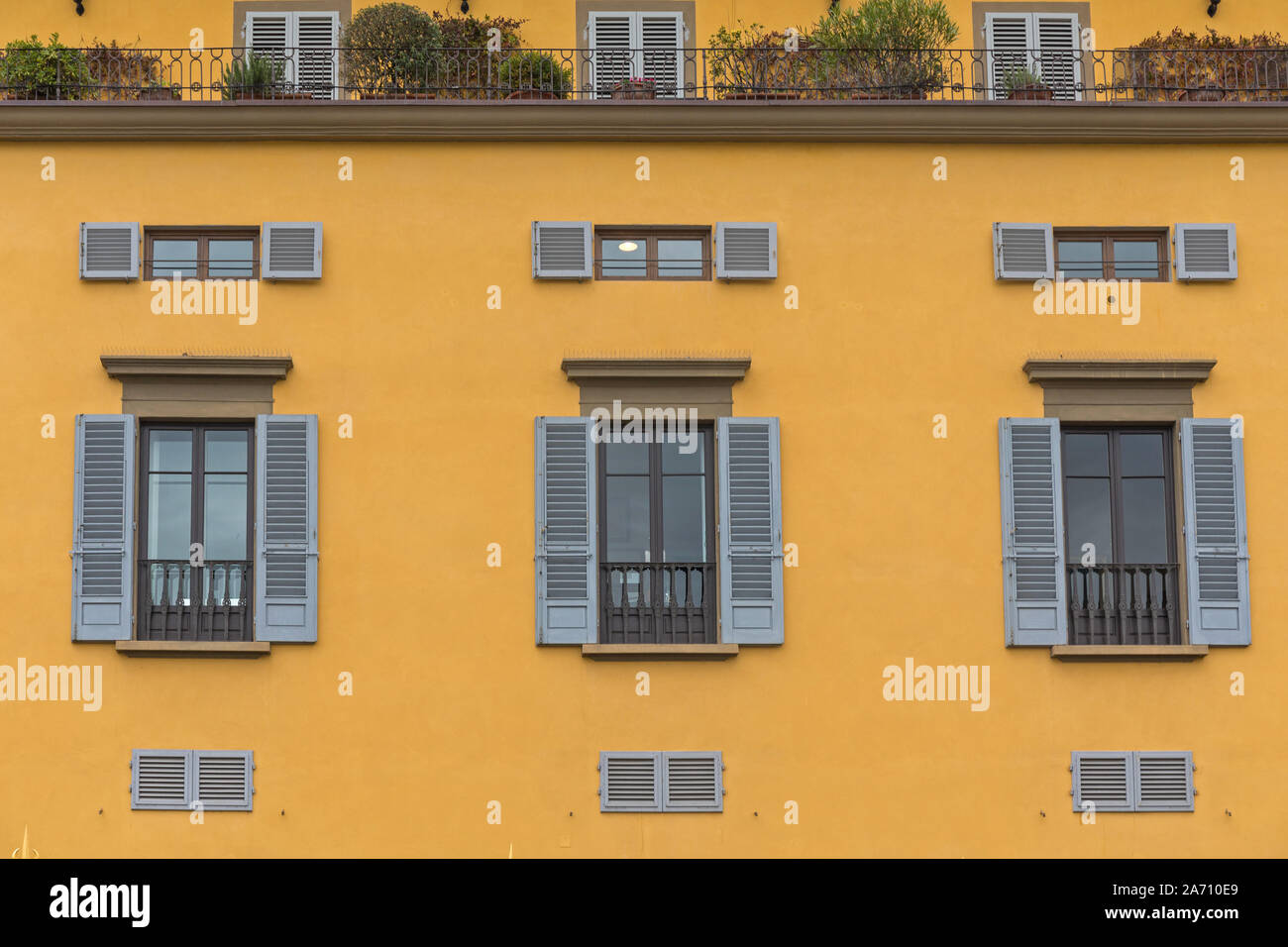 Yellow Residential Building in Florence Italy Stock Photo - Alamy