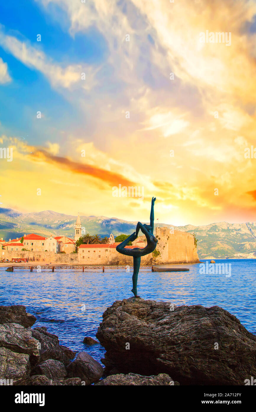Beautiful view of the sculpture Ballerina Dancer of Budva at sunset ...