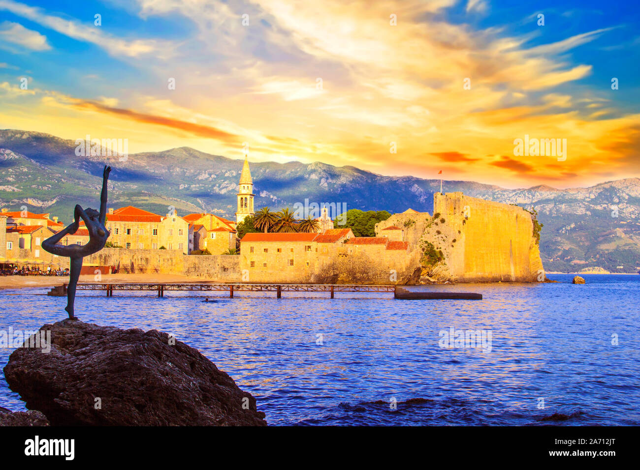 Beautiful view of the sculpture Ballerina Dancer of Budva at sunset ...