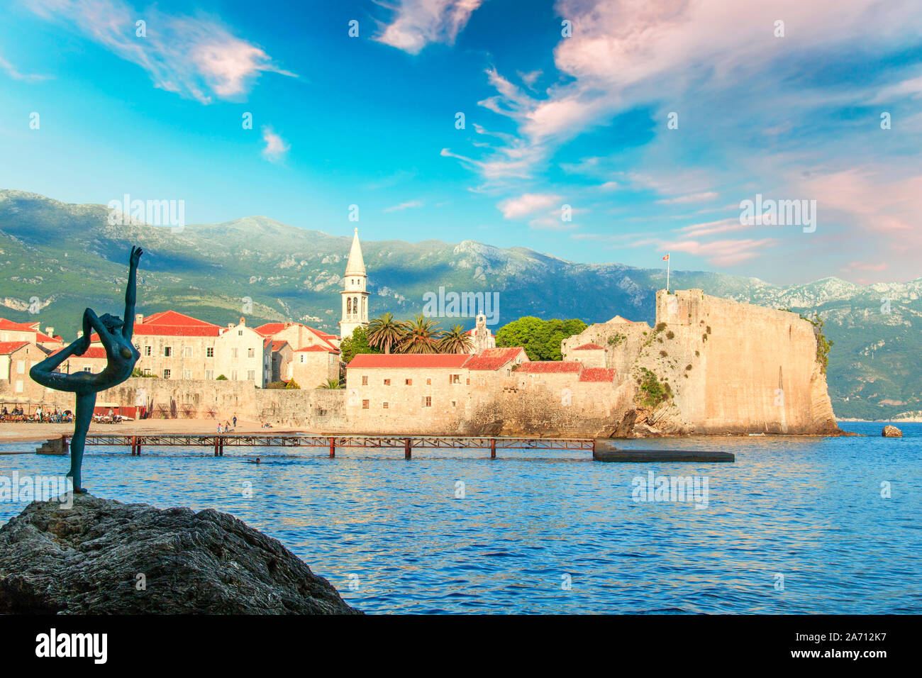 Beautiful view of the sculpture Ballerina Dancer of Budva at sunset ...