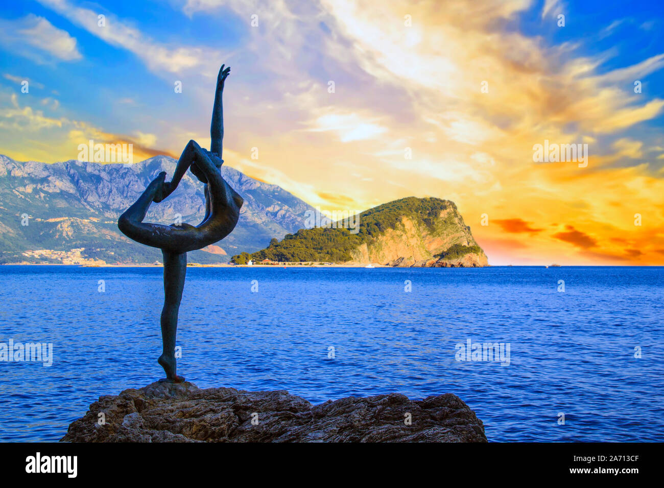 Beautiful view of the sculpture Ballerina Dancer of Budva at sunset ...