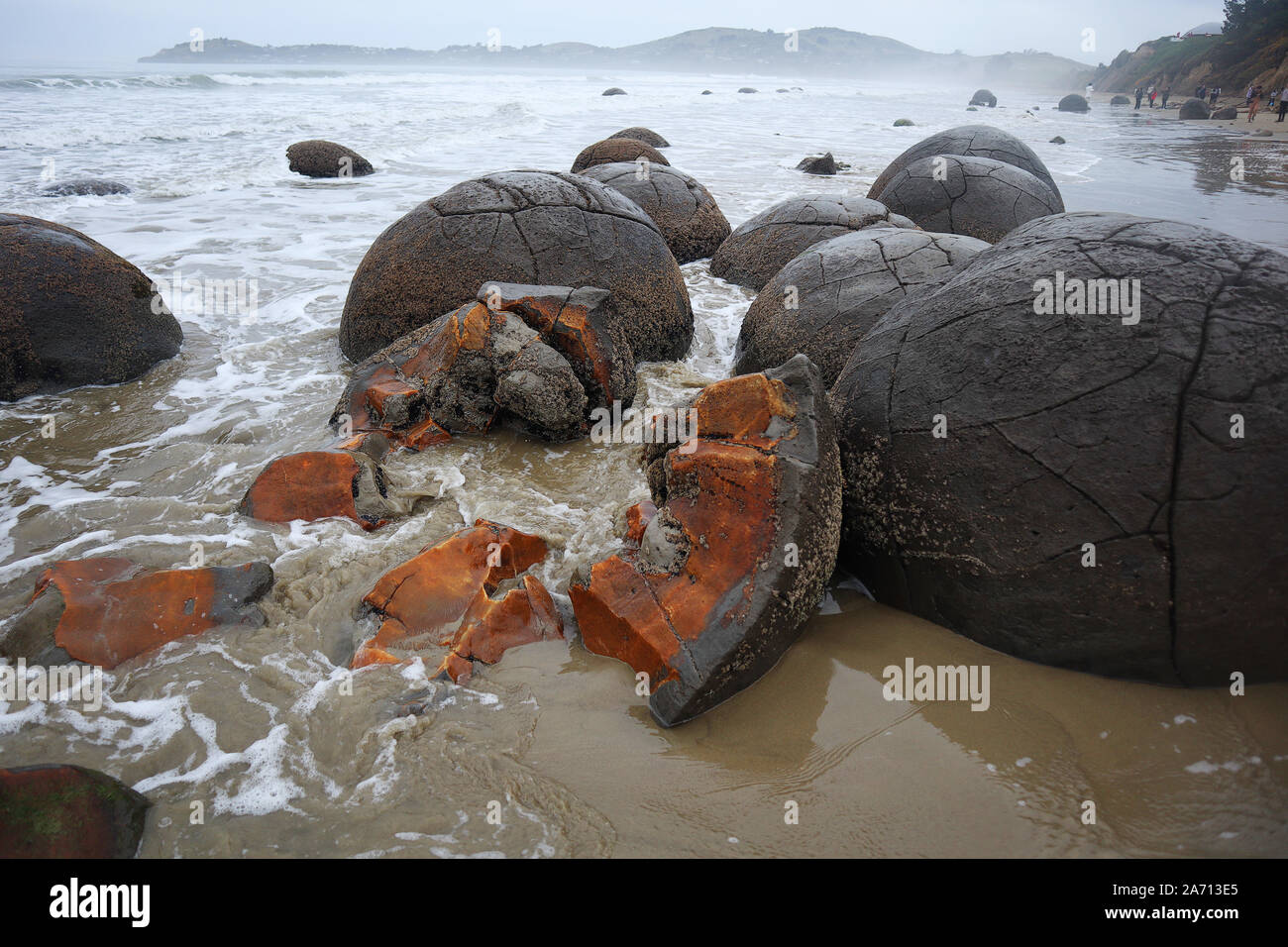 Boulders of volcanic rock on beach hi-res stock photography and images ...
