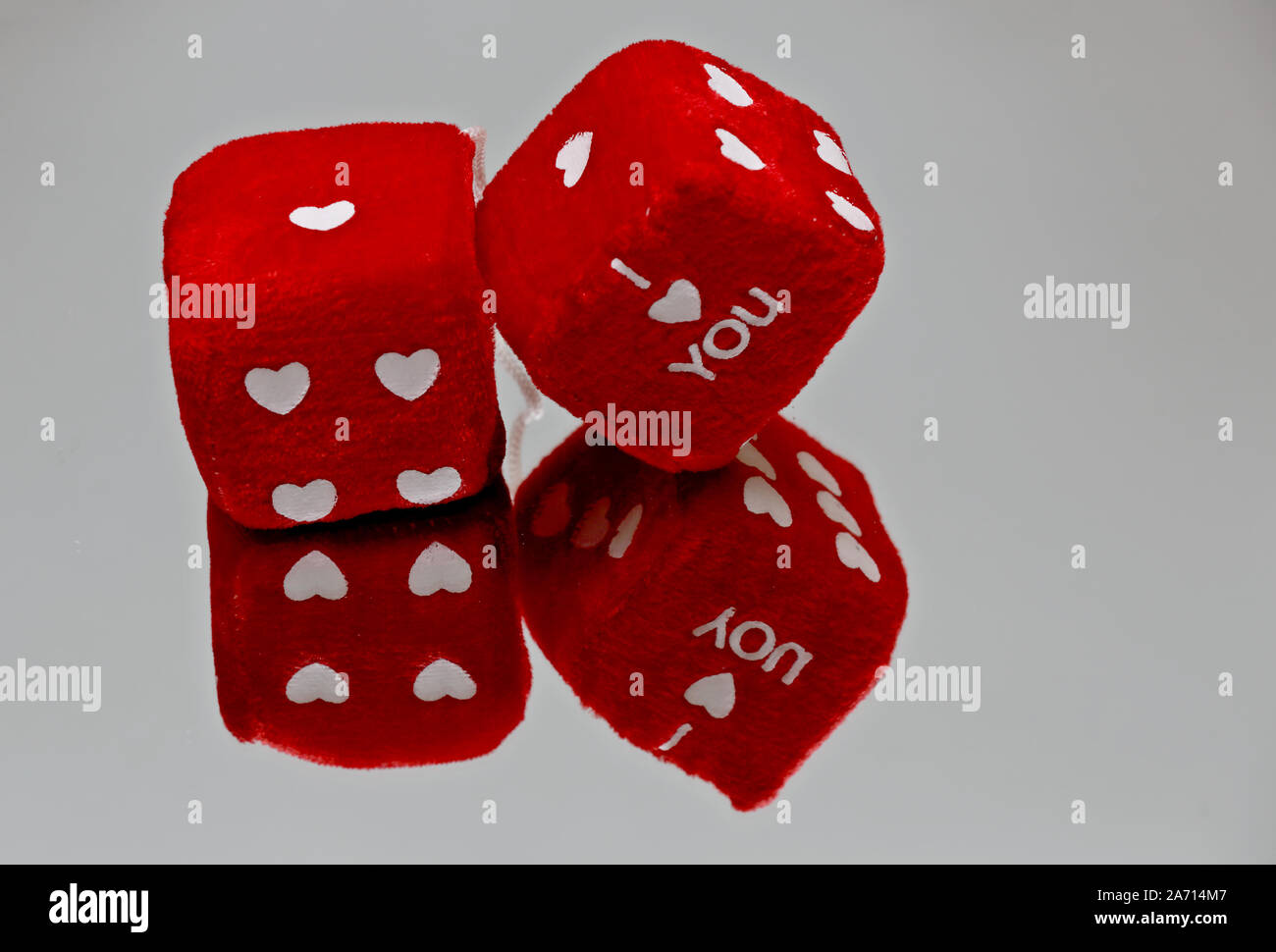 Two red dice with hearts as numbers Stock Photo - Alamy